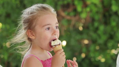 Girl Eating Ice Cream Stock Footage Video 100 Royalty Free 14319745