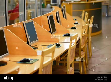 Wooden Tables And Many Computers Equipped With Computer Equipment