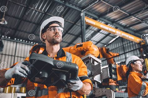 Engineer Team Working With Robot Welding In Automation Factory People