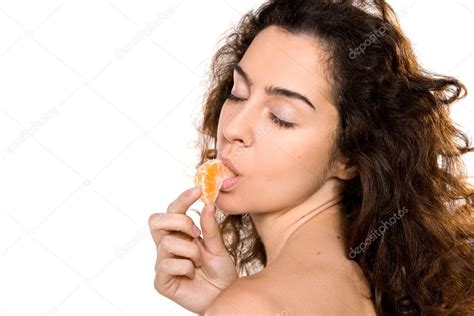 The Girl Biting A Segment Of Orange Stock Photo Yanapema 2402625