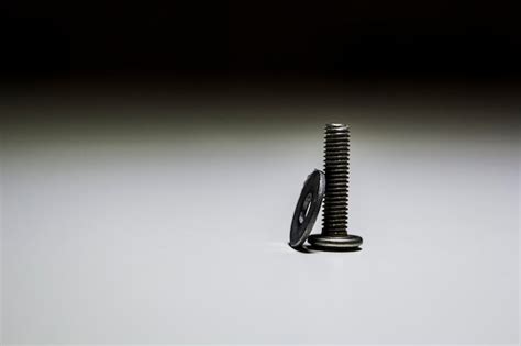 Premium Photo Close Up Of Nut And Bolt On Table Against Black Background