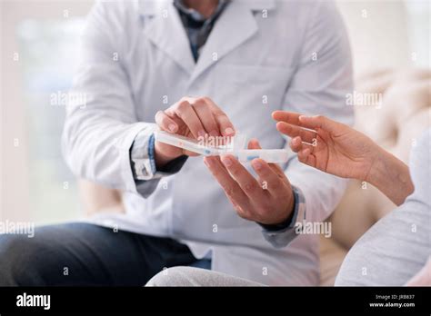 Professional Doctor Showing How To Use Container Stock Photo Alamy