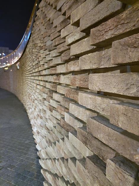 Premium Photo Decorative Long Brick Wall In Rounded Perspective The Brick Is Laid Out In A