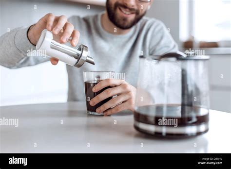 Close Up Sugar Container With A Dispenser In The Hands Of A Man Stock