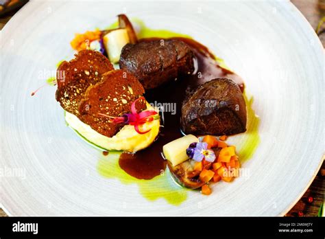 Deer Tenderloin Truffle Potato Puree Porcini Mushrooms Baked Leek And Carrot Juniper Bread