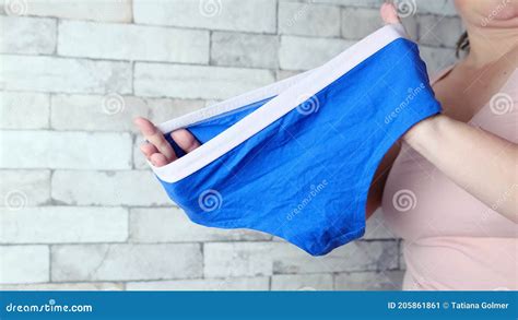 Woman Holding Blue Female Panties In Her Hands Knitted Underwear
