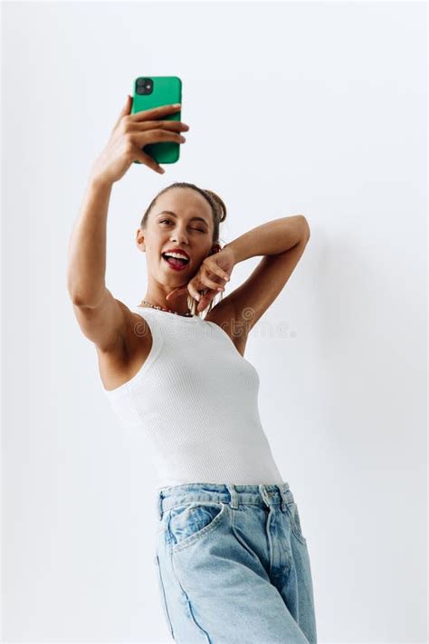 Millennial Woman With Beautiful And Tanned Skin Takes Selfies On Her