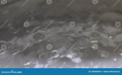 Close Up Of Boiling Water Bubbles In Dish Action Bubbling Clean Water