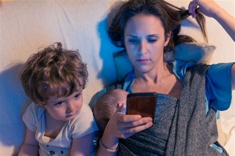 Premium Photo High Angle View Of Woman Using Mobile Phone While Lying