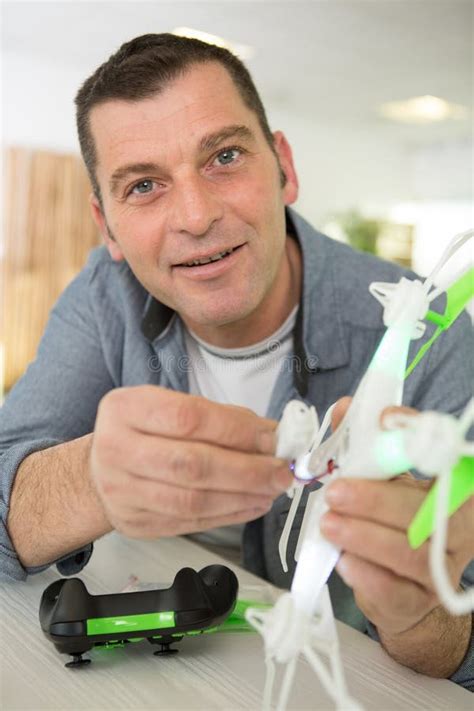 Man Working On Assembling Quadcopter Drone Stock Photo Image Of Maintenance Copter 326320124