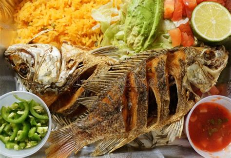 Pescado Frito Mexican Dish With Fried Tilapia Yellow Rice And Salad