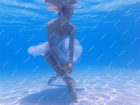 Premium Photo Ballerina Wearing Ballet Shoe In Swimming Pool