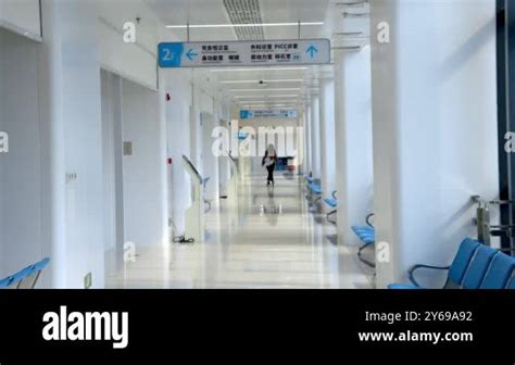 Hospital Corridor Nurse Pushing Wheelchair Patient People Seeing A