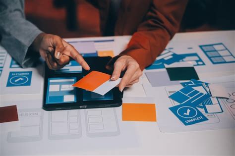 Premium Photo Team Of Ui Ux Web Designer Are Working Together To