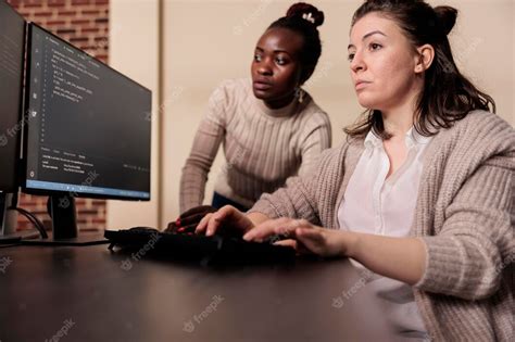 Free Photo Diverse Team Of Tech Enginners Talking About Programming In It Development Agency