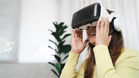 Premium Photo Young Asian Woman Wearing Virtual Reality Touching Air