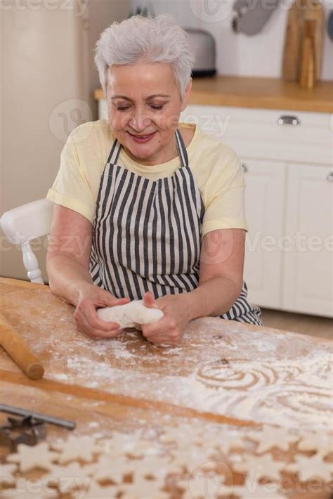 Happy Senior Woman Cooking In Kitchen Stylish Older Mature Gray Haired