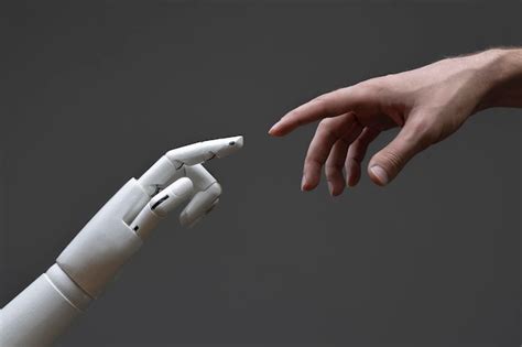 Premium Photo A Robotic Arm Touching Human Hand Man And Machine Friendship