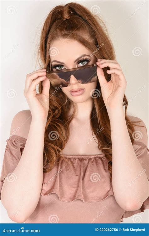 Beautiful Tall Slim Redhead Model In A Pretty Pink Bodysuit For Summer Stock Photo Image Of