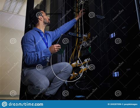 Tablet Server Room And Engineer With Connection Cable For Maintenance Or Software Update At