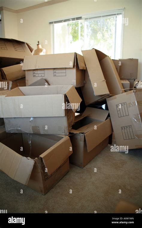 A Big Stack Of Empty Moving Boxes Unpacked In A New Home Stock Photo Alamy