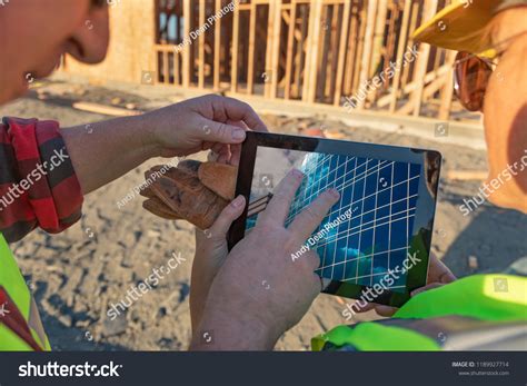 Male Female Construciton Workers Reviewing Building Stock Photo 1189927714 Shutterstock