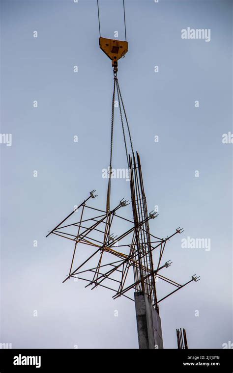 A High Rise Construction Crane Lifts The Lattice Structure Into The Zone Of Building Floor
