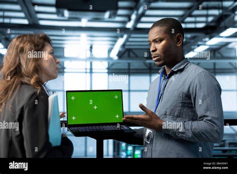 Engineer In Data Center Using Chroma Key Laptop Refining Server
