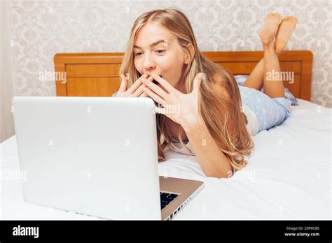 Beautiful Girl With A Laptop Wakes Up In The Morning Talking On Skype