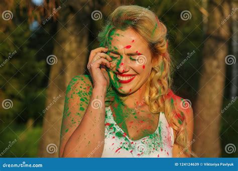 Smiling Caucasian Blonde Girl With Bright Makeup Posing Covered Stock