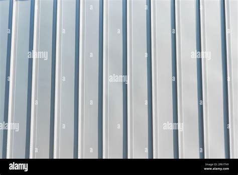 The Texture Of The Cladding Of The Building From Metal Aluminum Panels Abstract Background For