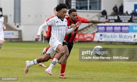 Dunfermlines Kane Ritchie Hosler And Clydes Rico Quitongo During A