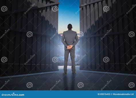 Composite Image Of Young Businessman Standing With Hands Behind Back 3d