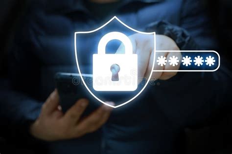 Cybersecurity Concept A Person Holds A Smartphone Displaying A Shield With A Lock Symbol