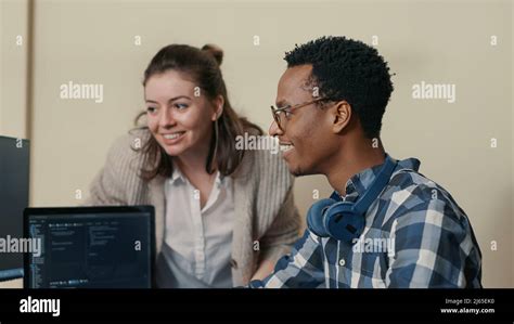system engineers celebrating successful code compiling doing high five hand gesture with