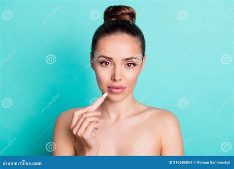 Portrait Of Attractive Naked Nude Girl Applying Lip Balm Form
