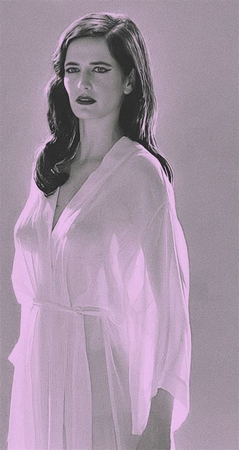 A Woman In A White Shirt Posing For A Photo With Her Hands On Her Hips