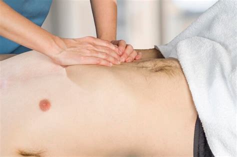Premium Photo Midsection Of Woman Massage Therapist Analyzing Man In