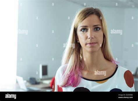 Attractive Woman With Trendy Pink Highlights In Her Long Hair Stock
