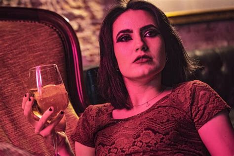 Premium Photo Seductive Rebel Brunette Girl Holding A Drink With A