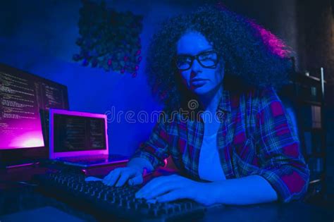 Young Female Programmer In A Creative Home Office Immersed In Coding At Night Illuminated By