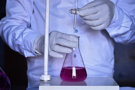 The Chemist Adds Solutions With Precision Ensuring Accurate Neutralization In The Acid Base