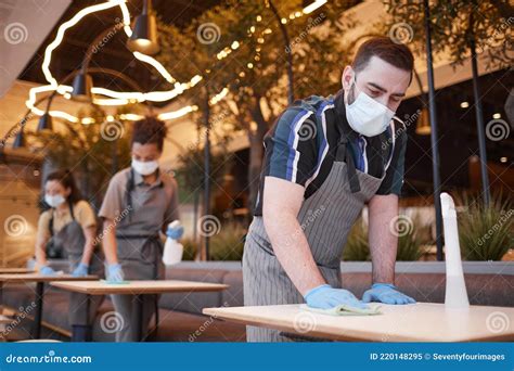 Group Of Workers Sanitizing Cafe Tables Stock Image Image Of Cafe
