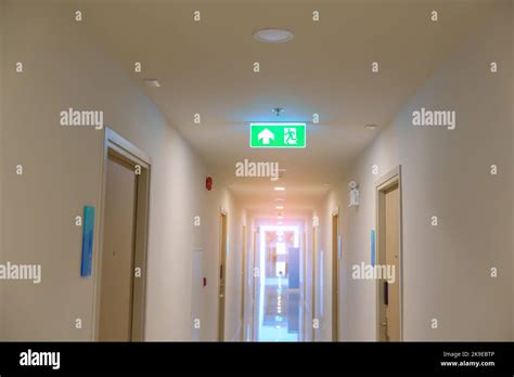 Fire Emergency Exit Sign On The Wall Background Inside Building Safety Concept Stock Photo Alamy