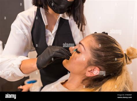 Close Up Photo Of An Unrecognizable Professional Makeup Artist Wearing