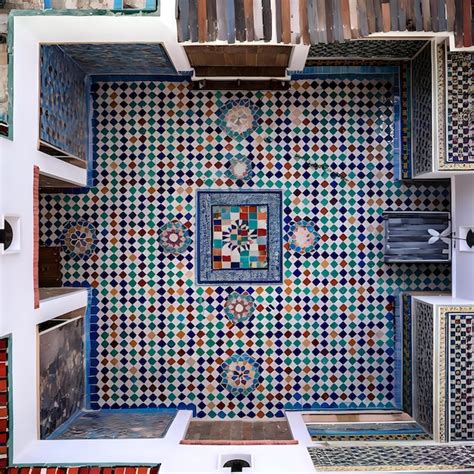 A Colorful Mosaic Tile Display With A Blue And Red Mosaic Tile Design