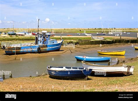 Creek At Brancaster Staithe Norfolk With Sailing Boats And Marsh