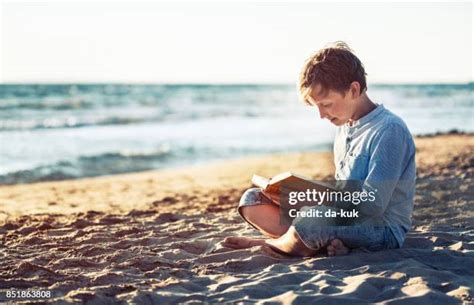 Boy Reading Beach Photos And Premium High Res Pictures Getty Images