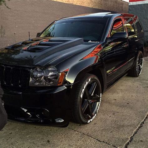 Jeep Srt8 Parked In Front Of A Graffiti Covered Building Dodge Jeep