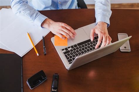 Free Photo Man Working On Laptop Sitting At Table